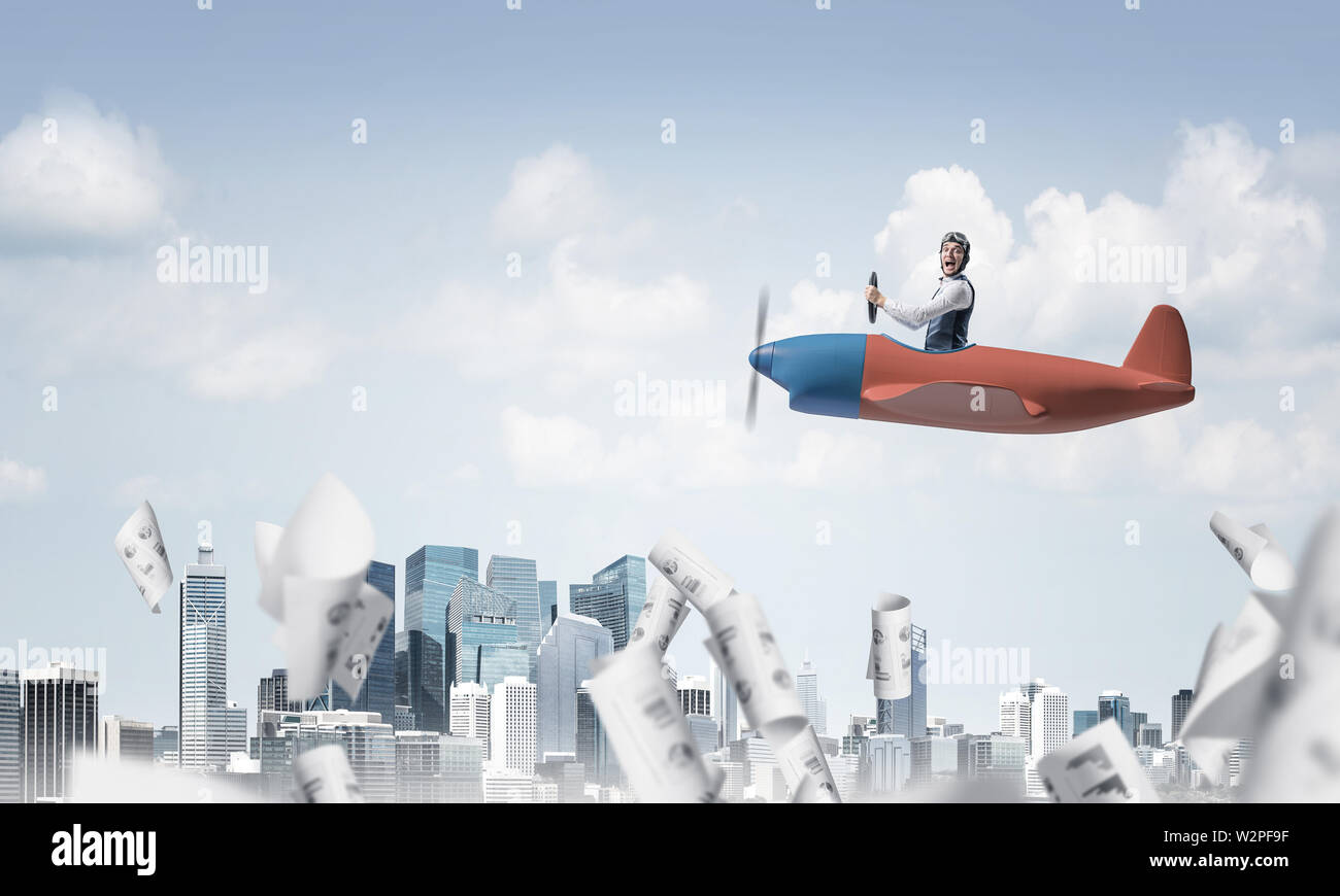 Satisfied emotional pilot sitting in airplane Stock Photo - Alamy