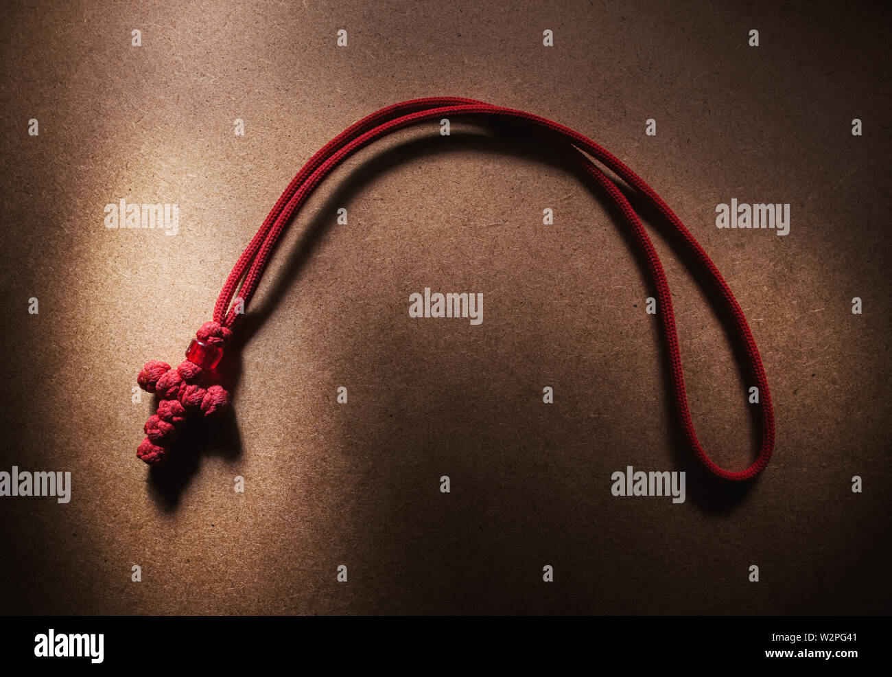 Red cross made of ropes, studio composition Stock Photo - Alamy