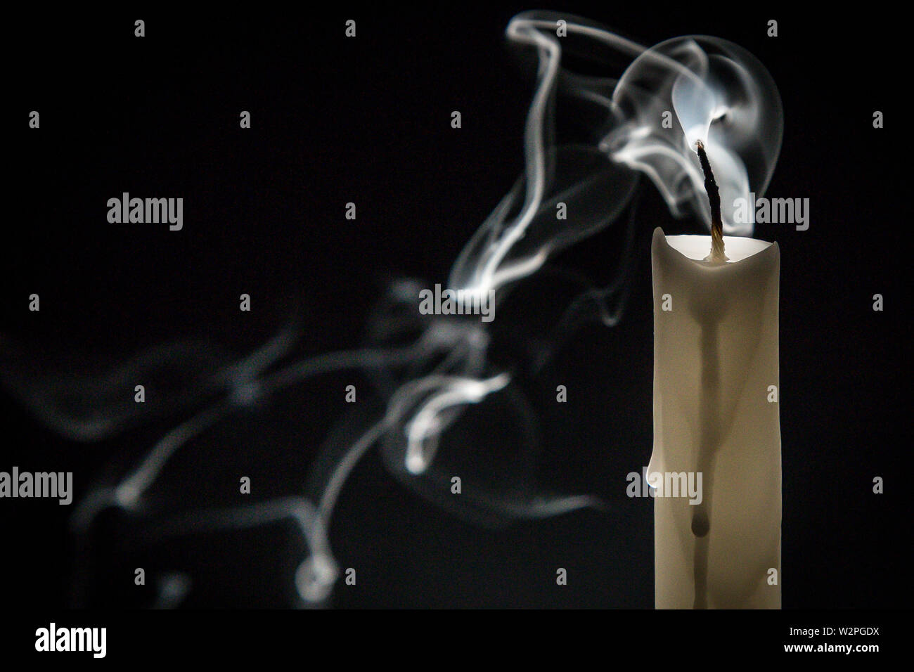 Smoke candle on a black background Stock Photo - Alamy