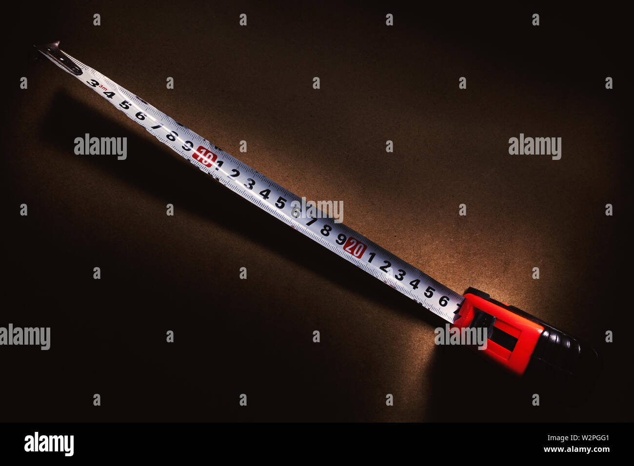 Metering tool in centimeters, on brown background surface, in dark ...