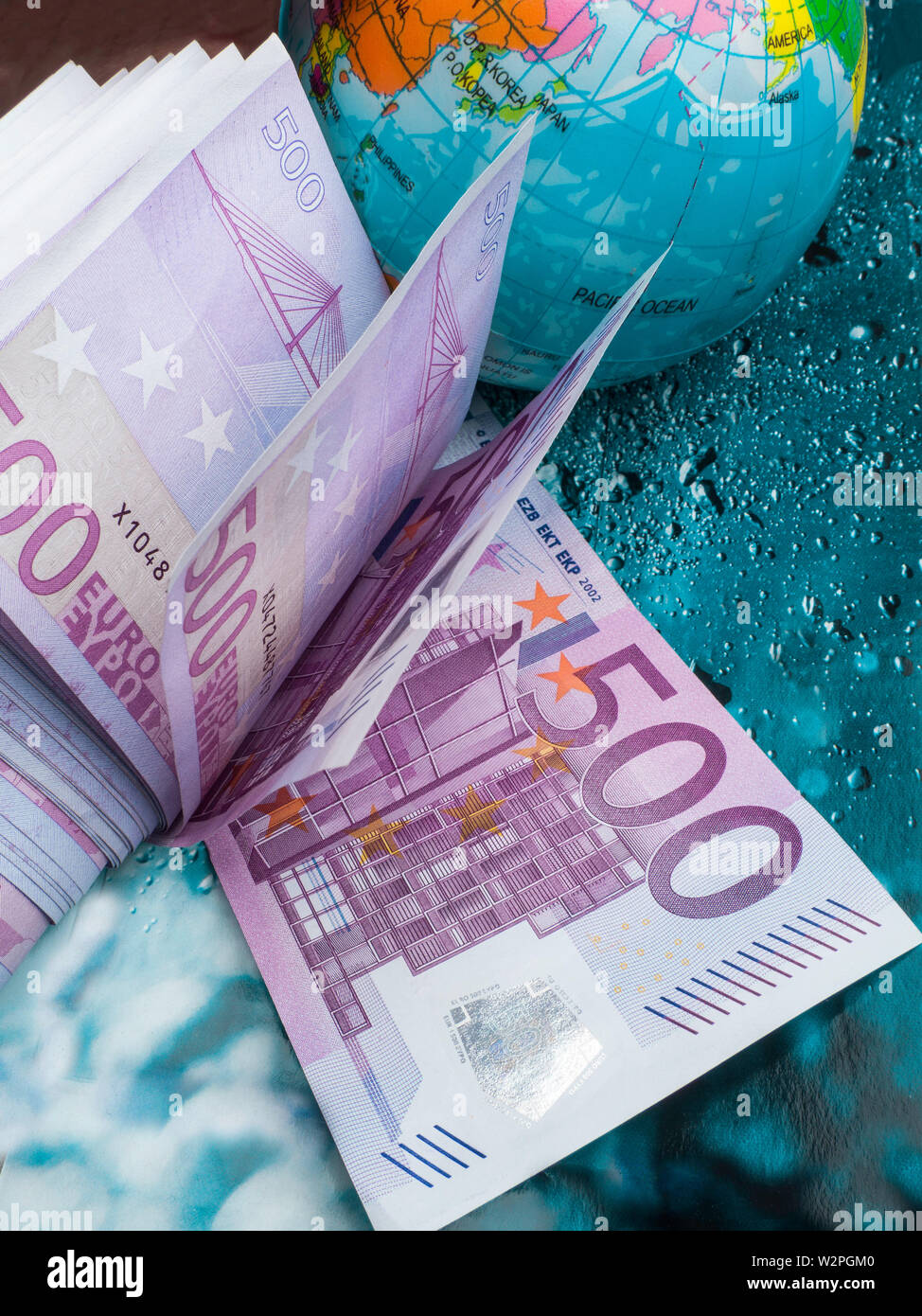 Globe, map of Europe, Eu banknotes in denominations of 500 euros ...