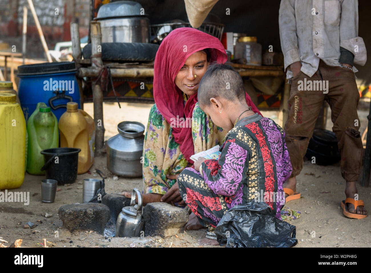 Ajmer, India - February 07, 2019: Indian woman with girl sitting on the ...