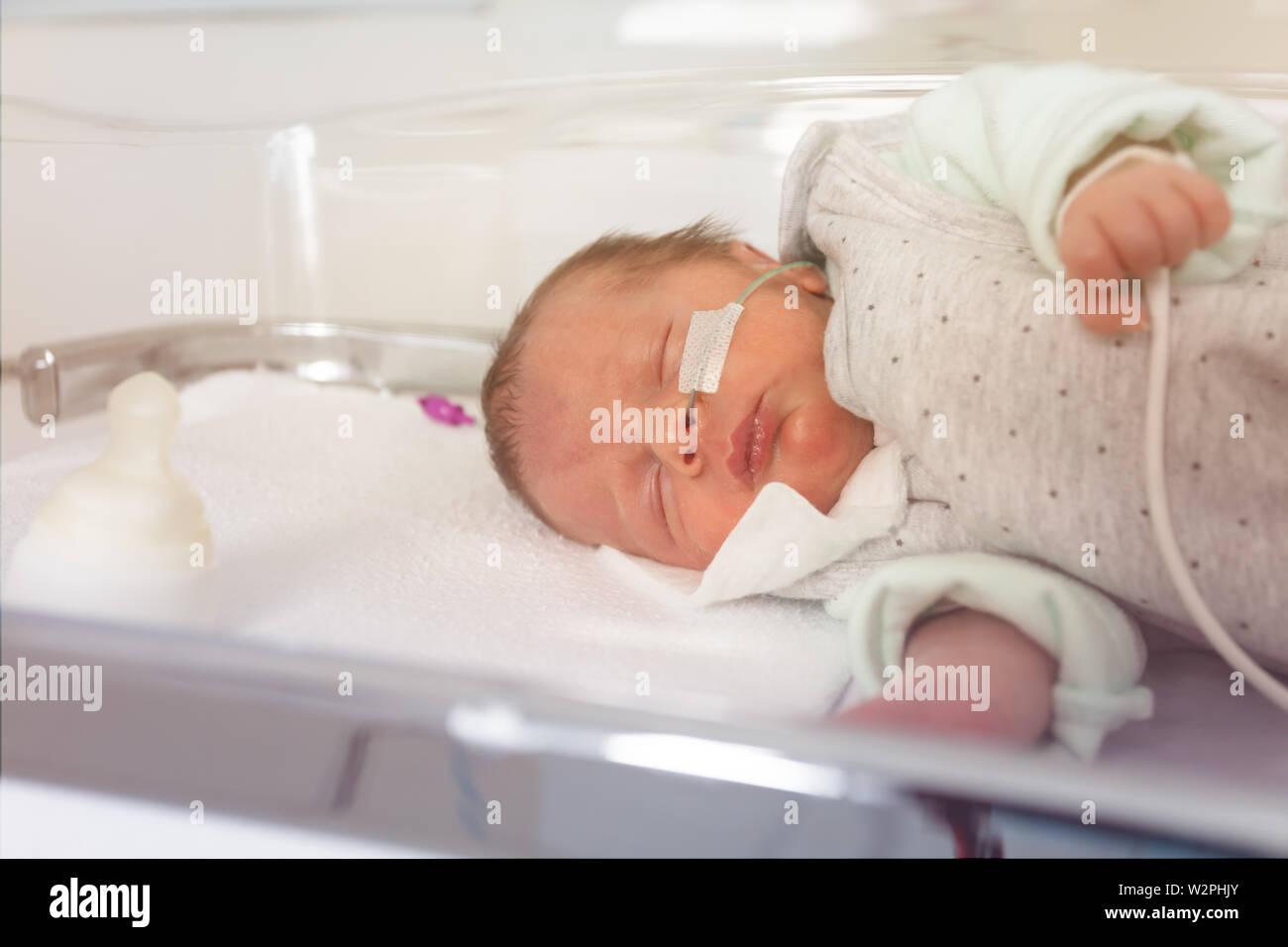 Portrait of a baby in hospital crib ICU room Stock Photo - Alamy