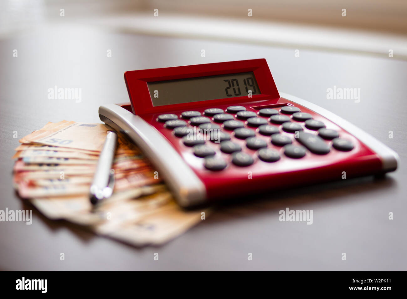 Budget planning Concept. Calculator, euro currency banknotes and a pen ...