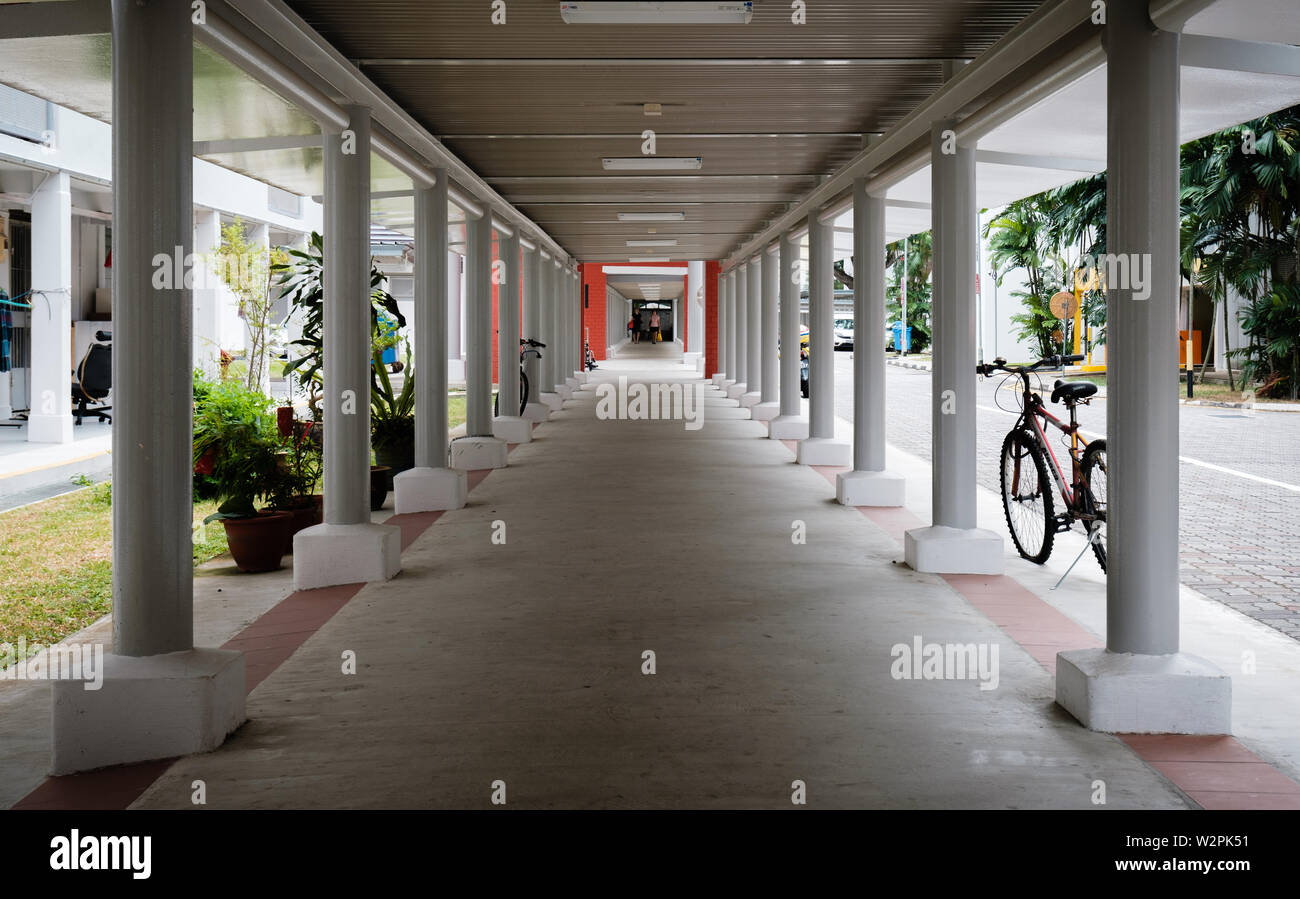Singapore-02 MAR 2019:Singapore HDB area shelter walkway corridor view ...