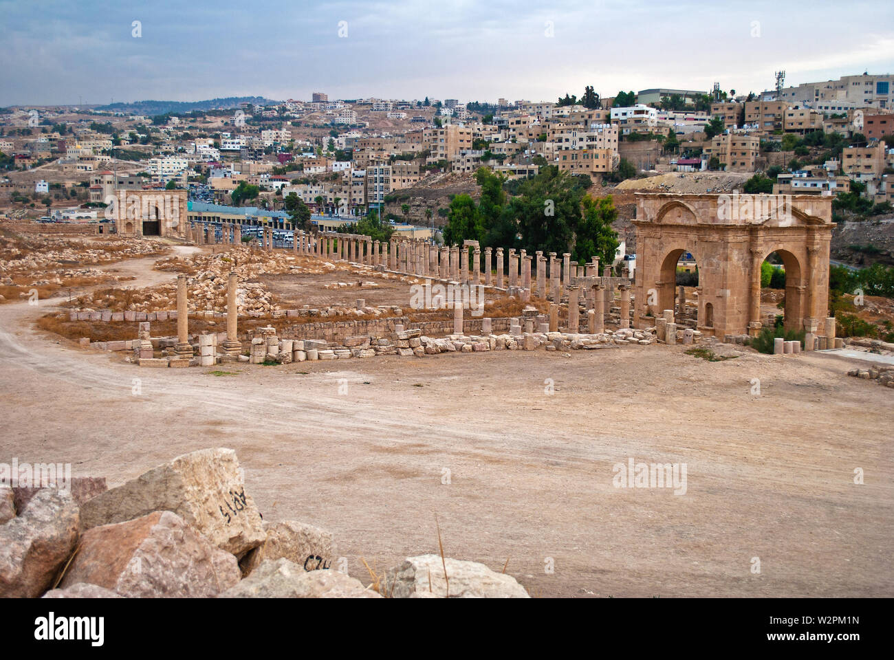 Ruins of the Greco-Roman city of Gera at Jordan in a contrast with a ...