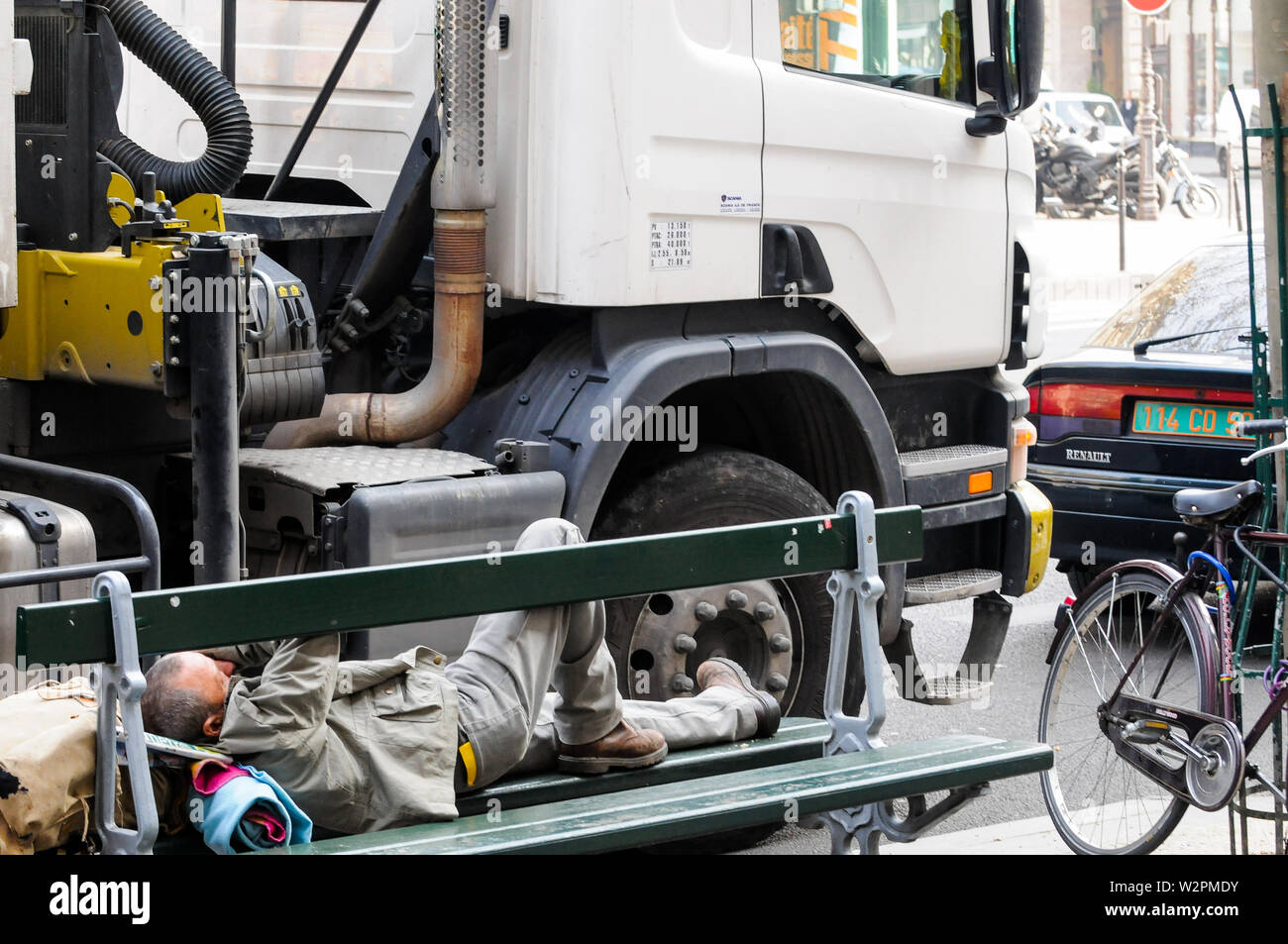 Homeless laying on a bench, Paris, Ile-de-France, France Stock Photo ...
