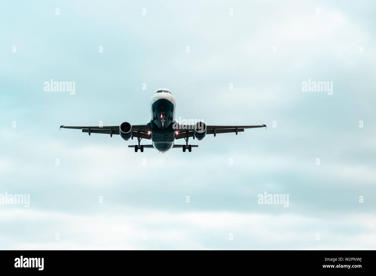 Airplane flying up in the sky with a beautiful blue sky in the ...