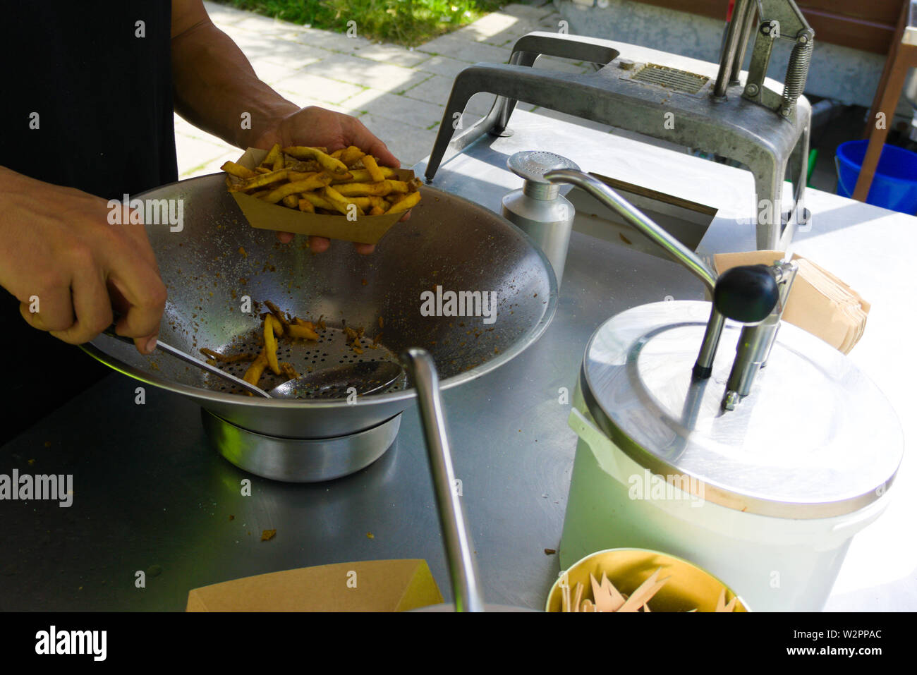 snackbar selling fries on the street fair Stock Photo - Alamy