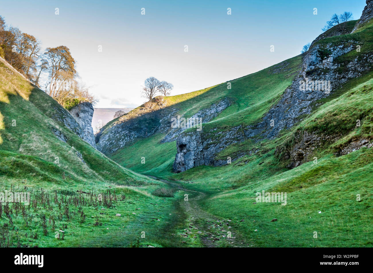 The lower end of Cave Dale, a dry limestone valley through reef ...