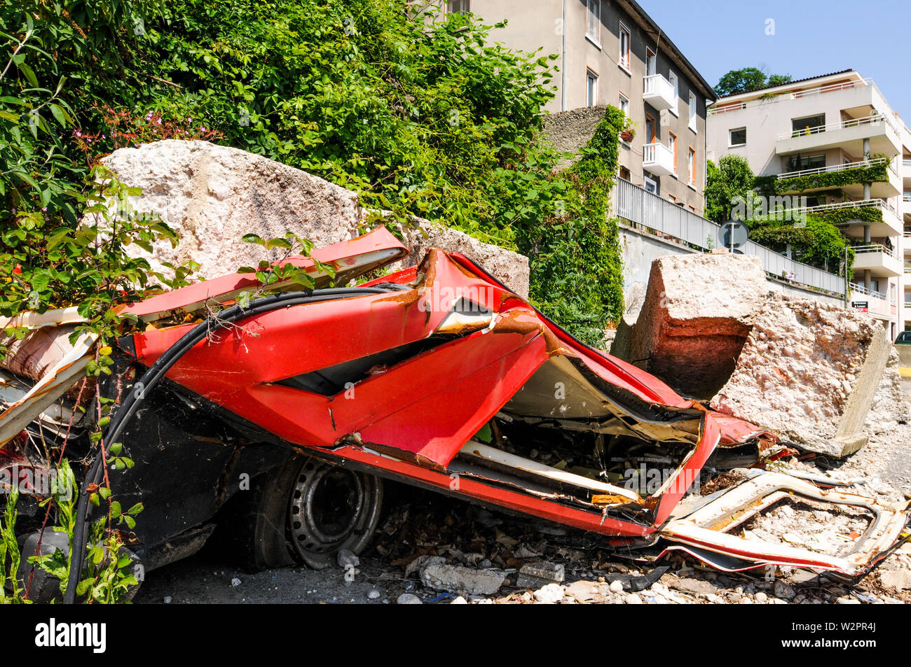 Wreck of a car crushed by a wall after a landslide, Saône river quays ...