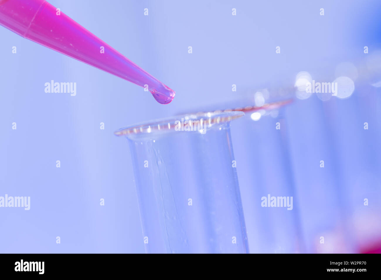 Test tube in rack and pipette media dispenser Stock Photo - Alamy