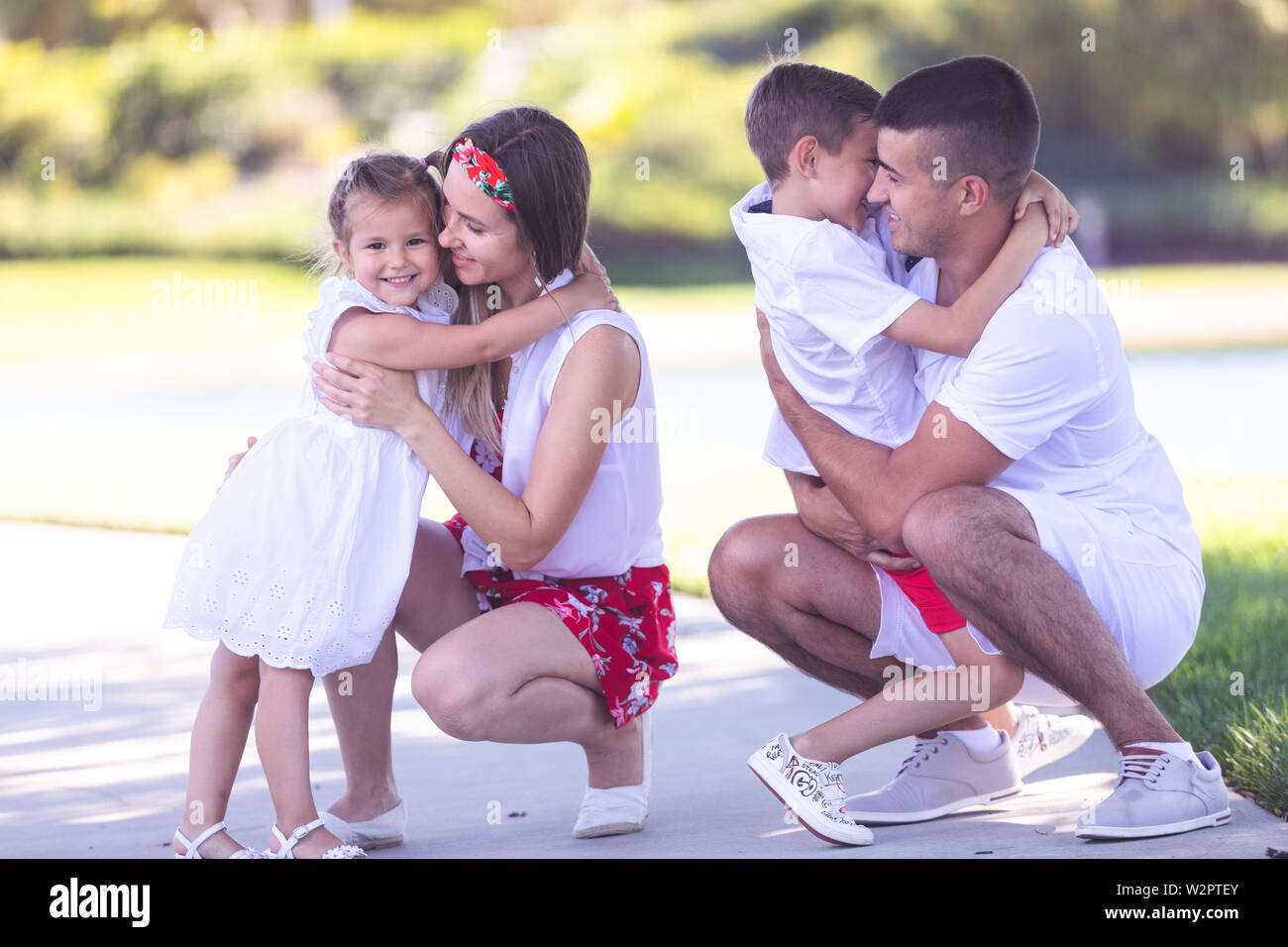 Happy family having fun together in the beautiful park Stock Photo - Alamy