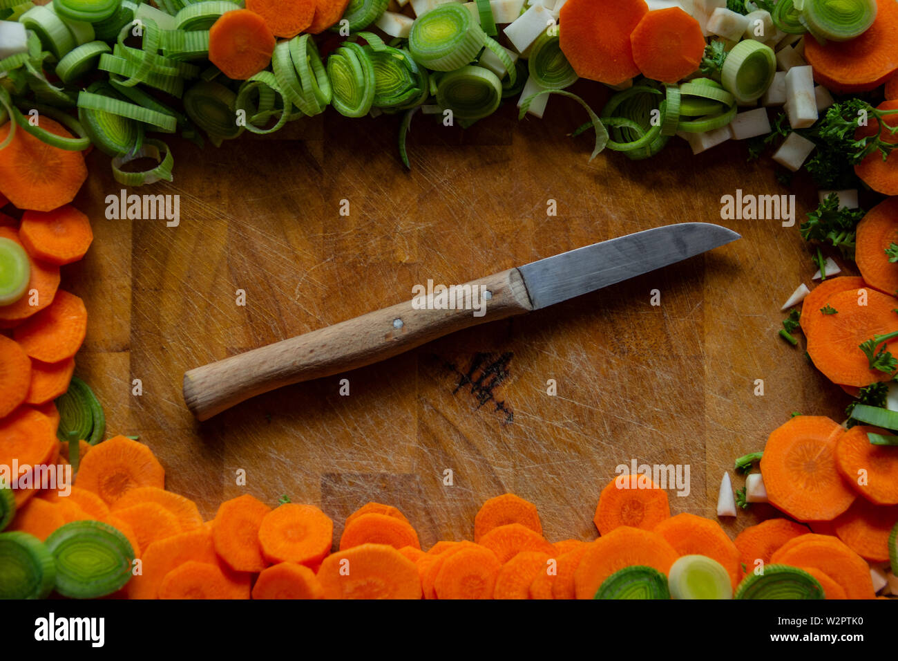 Chopped vegetables and a knife. Copy space for text. Vegan and healthy ...