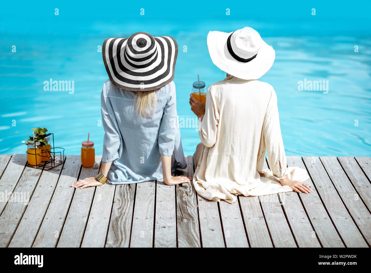 Two women at poolside hi-res stock photography and images - Alamy