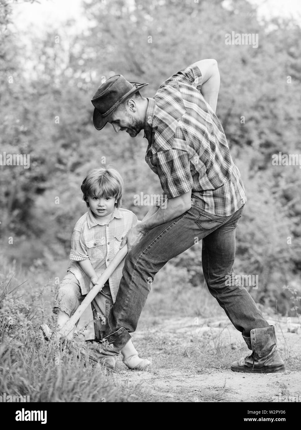 Little boy and father with shovel looking for treasures. Happy ...