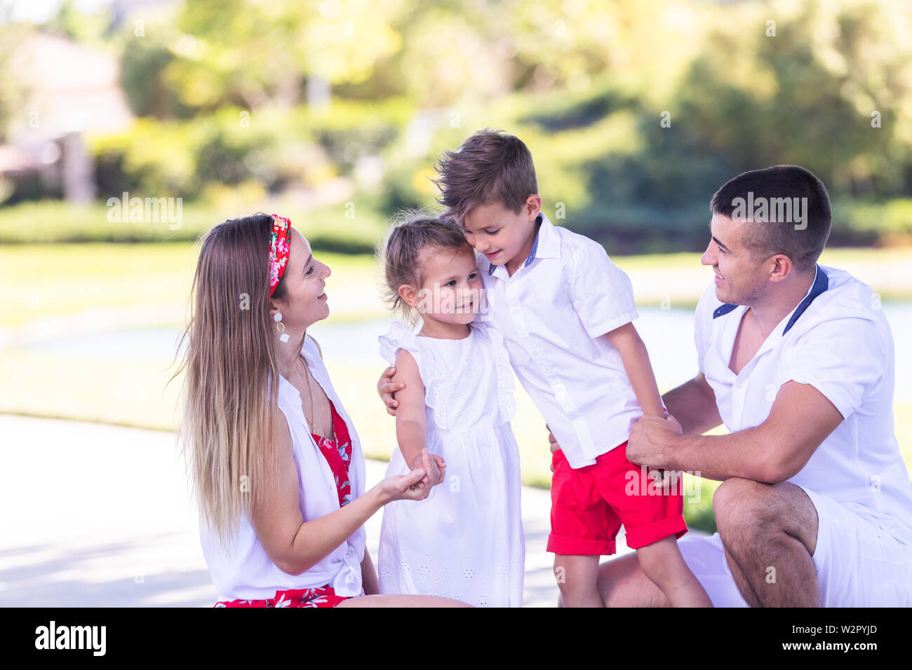 Happy family having fun together in the beautiful park Stock Photo - Alamy