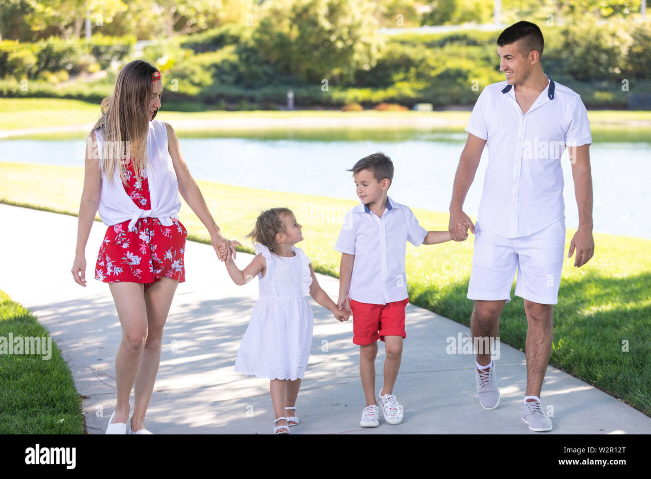 Happy family having fun together in the beautiful park Stock Photo - Alamy