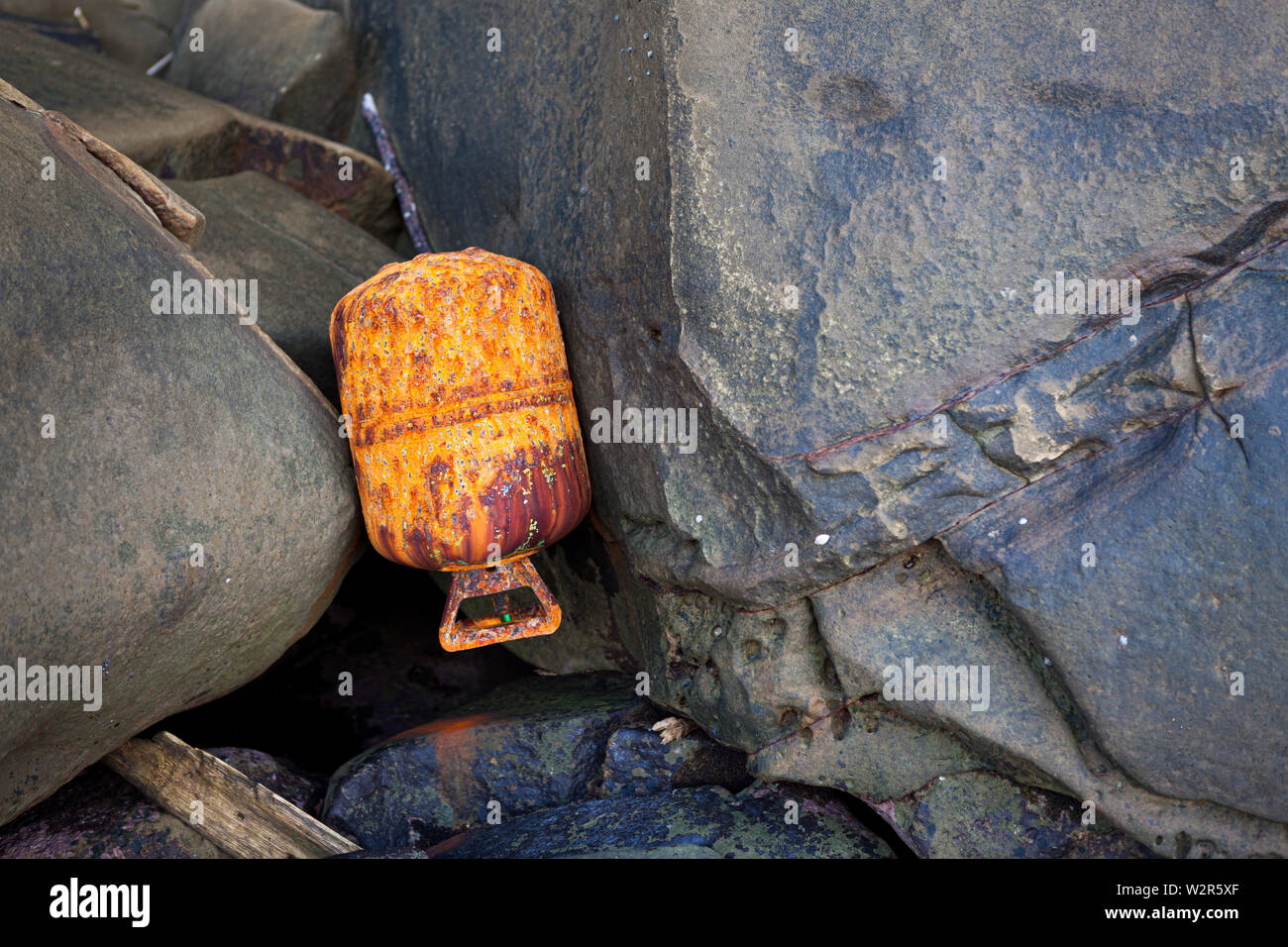 Used rusty gas cylinder in shore Stock Photo - Alamy