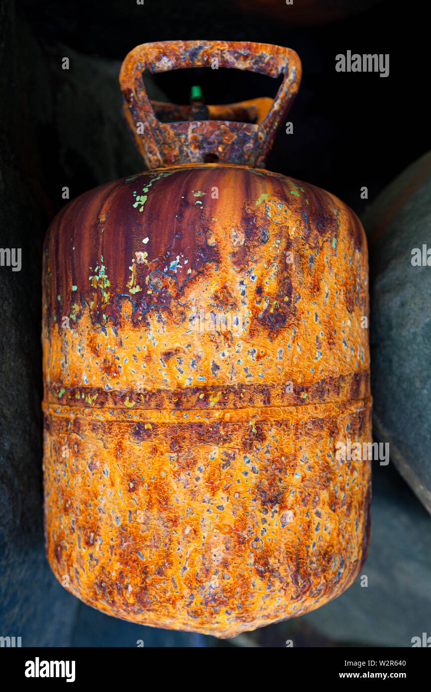 Used rusty gas cylinder in shore Stock Photo - Alamy