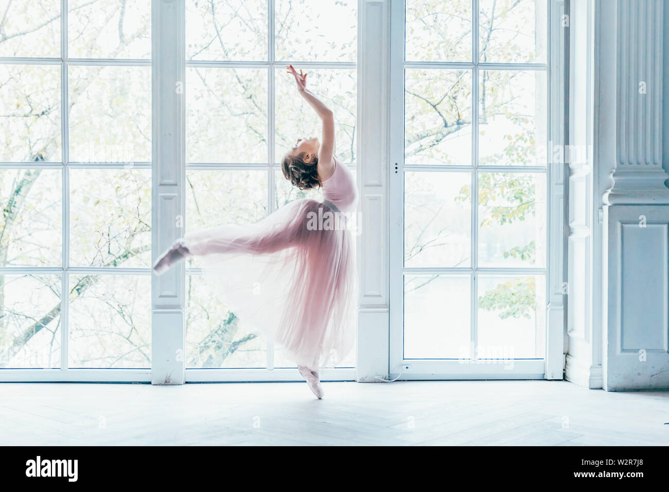 Young classical ballet dancer girl in dance class. Beautiful graceful ...