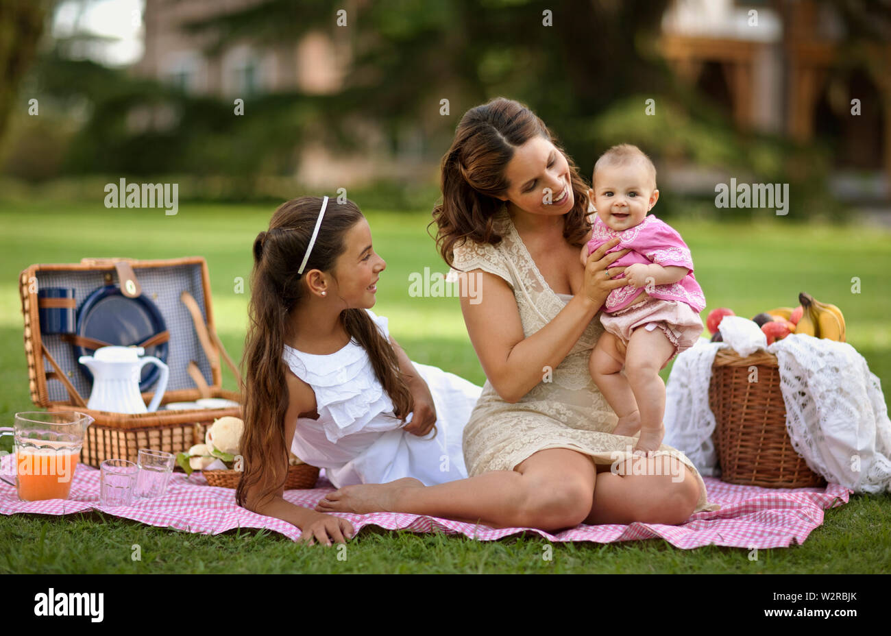 Happy daughters having picnic hi-res stock photography and images - Alamy