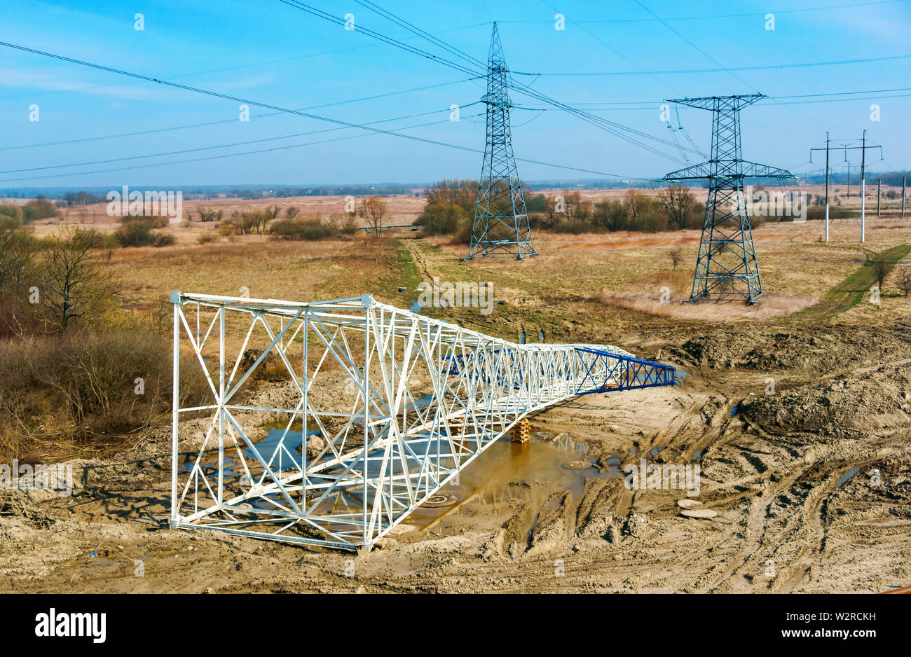 the power line support lies on the ground, replacing and installing ...