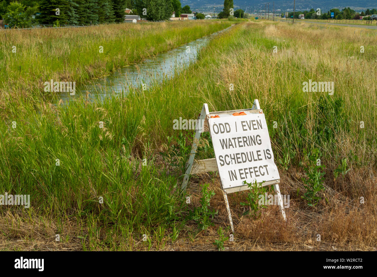 A watering schedule sign placed at the entrance to a subdivision to ...