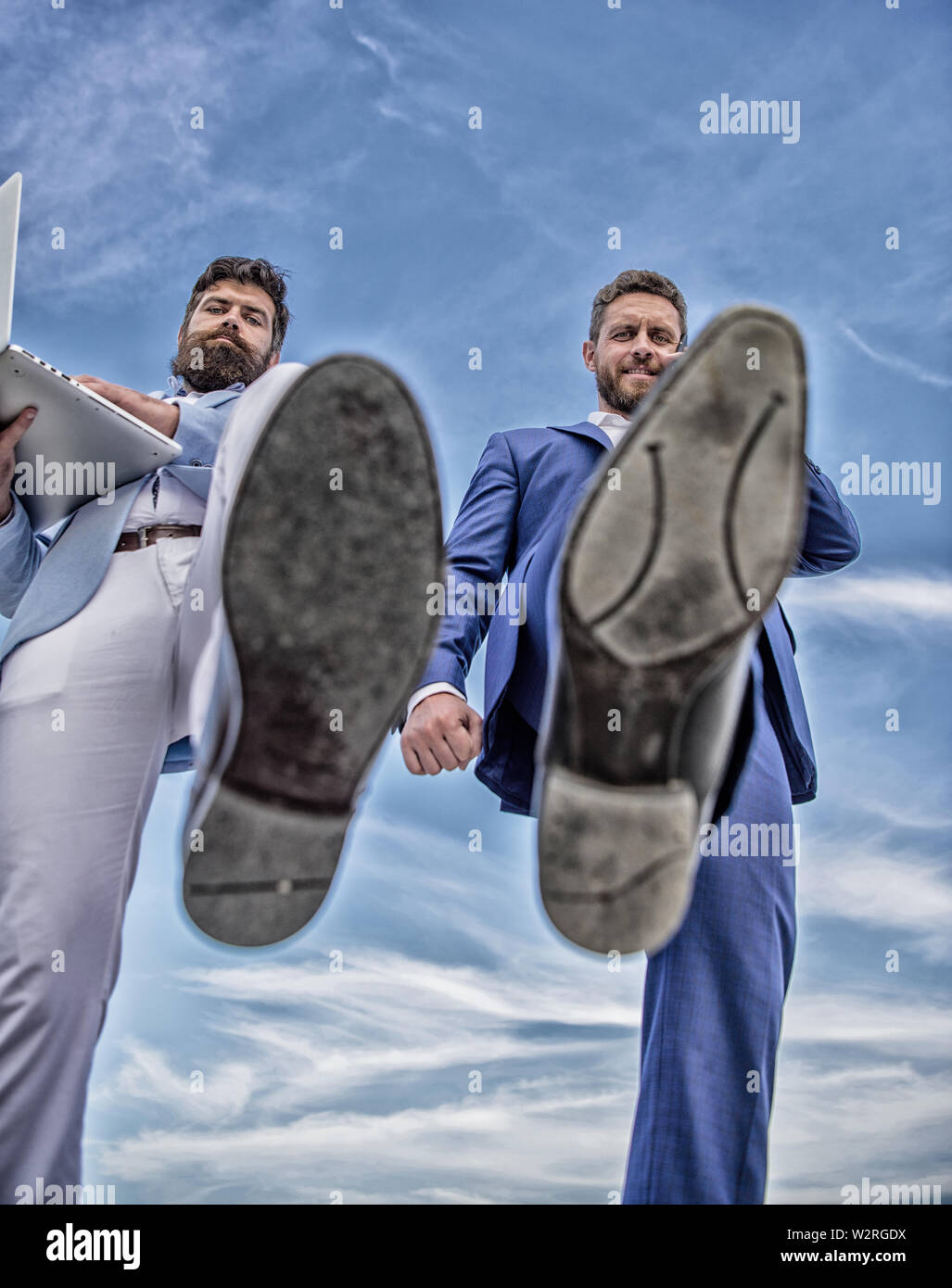 Business partner busy with phone call moving forward, foot shoe close ...