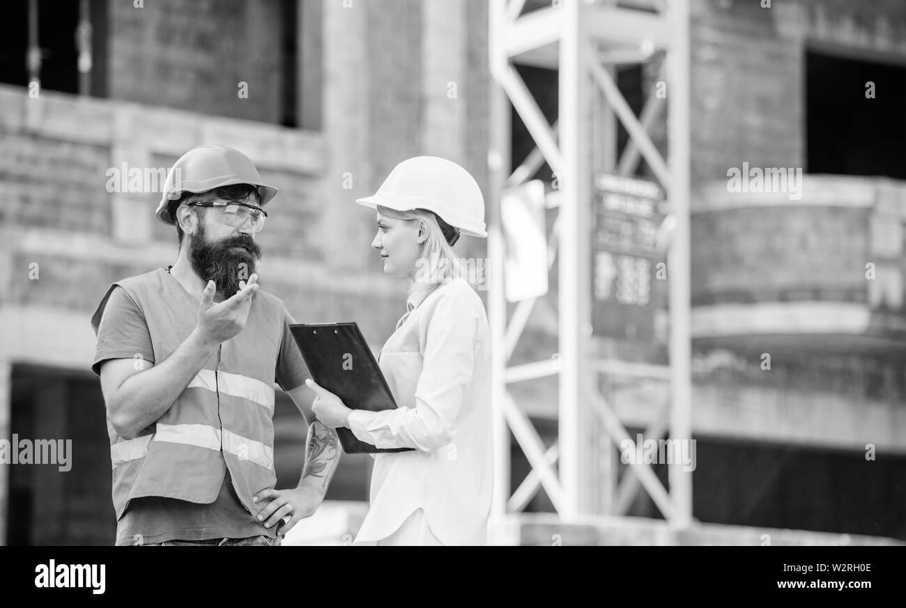Construction industry concept. Discuss progress project. Woman engineer ... Construction industry concept. Discuss progress project. Woman engineer ...