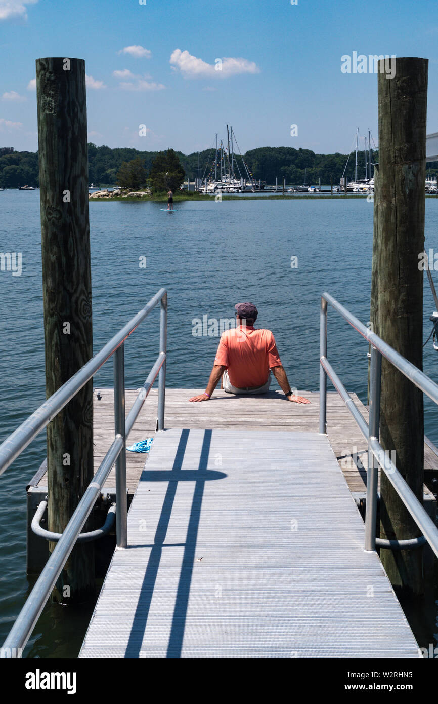 Single man sitting hi-res stock photography and images - Alamy