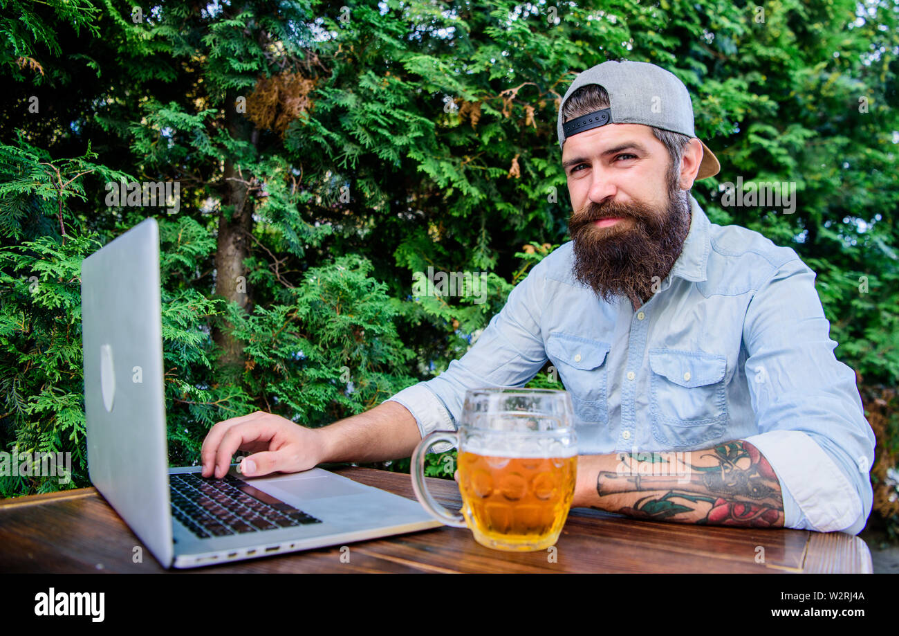 Laptop continues to assist virtual employees. Laptop user drinking beer ...