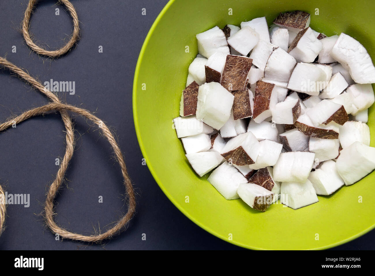 Pieces of coconut in a green plate Stock Photo - Alamy