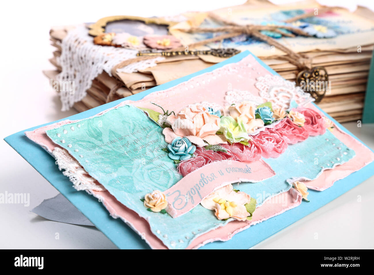 Handmade scrapbooking boxes and books items on white background Stock ...