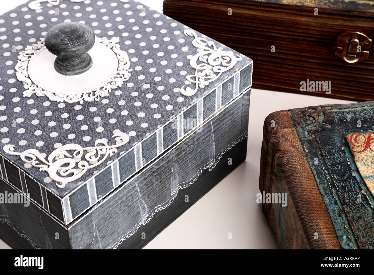 Handmade scrapbooking boxes and books items on white background Stock ...