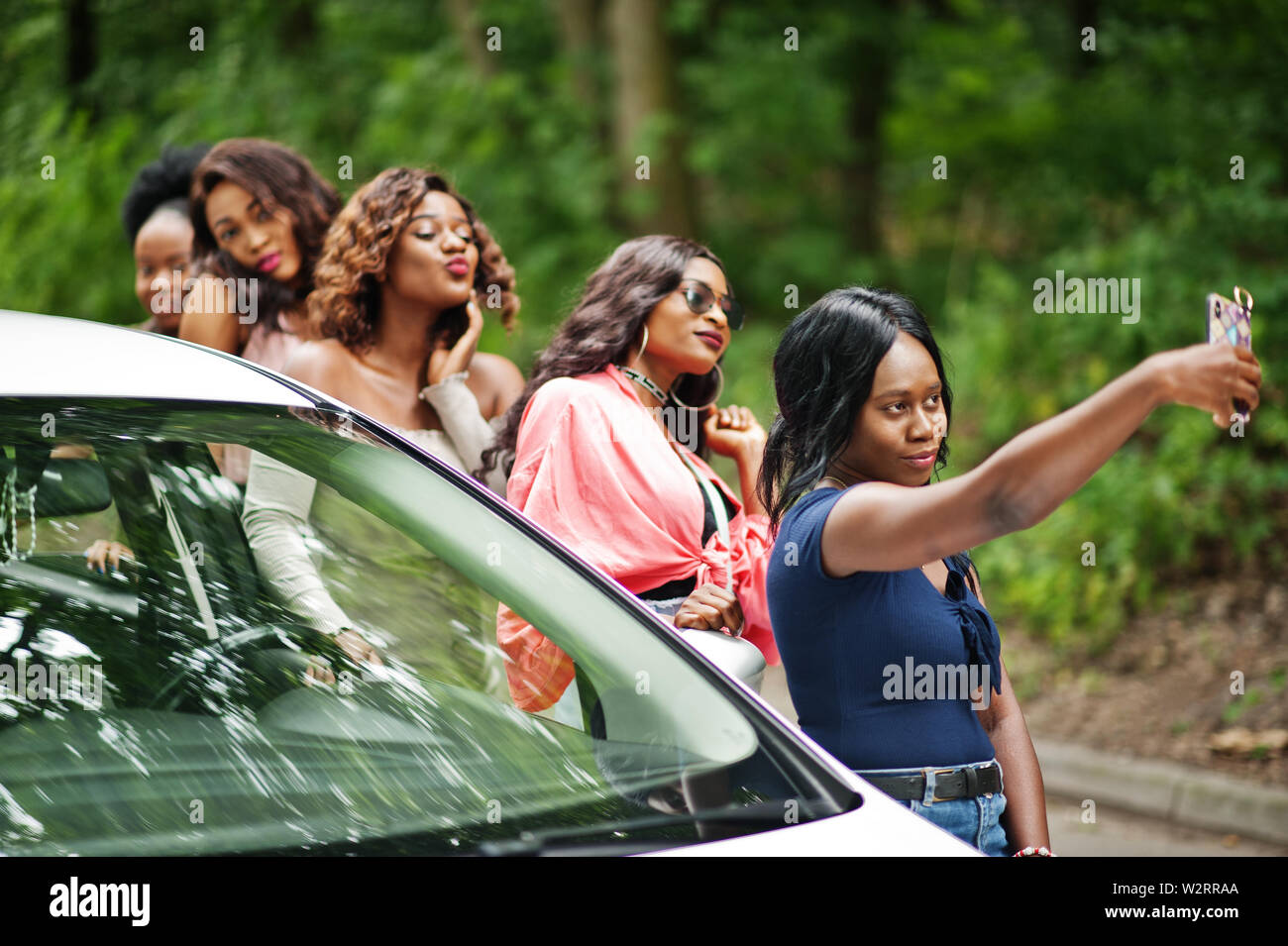 Group of five happy african american traveler girls making selfie ...