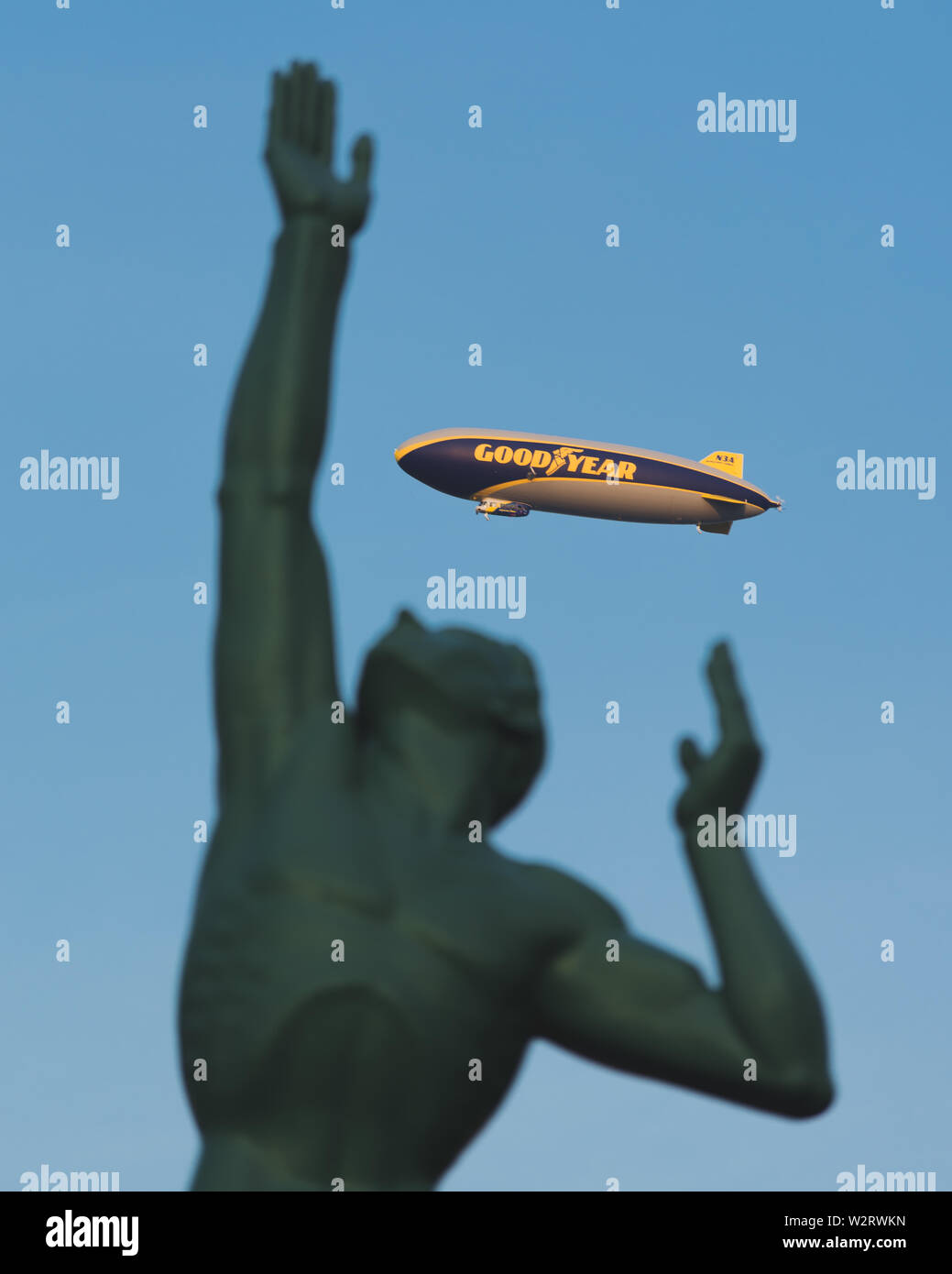 Goodyear Blimp over the Statue of Eternal Life Stock Photo - Alamy