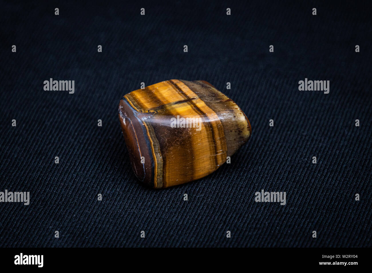 Tiger eye gemstone beautiful gemstone shining in yellow and brown Stock ...