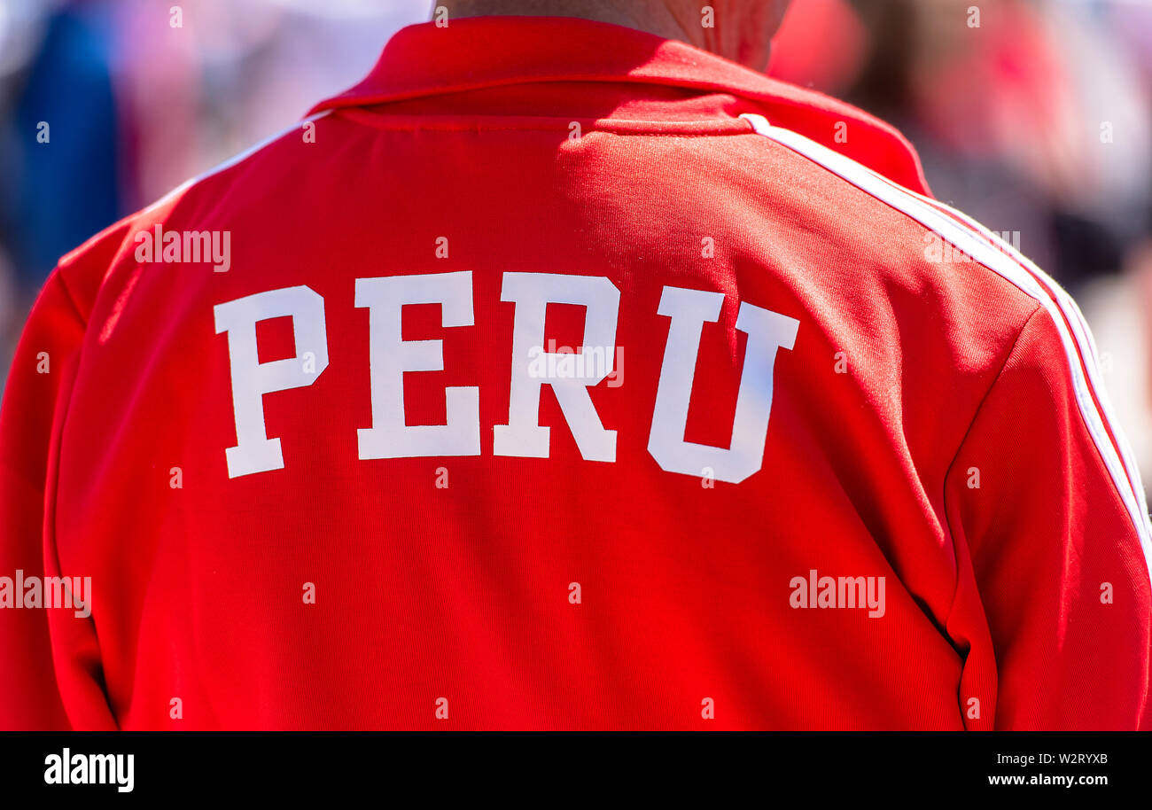 Back of Football Fan dressed in Sport red Shirt Peru Stock Photo - Alamy