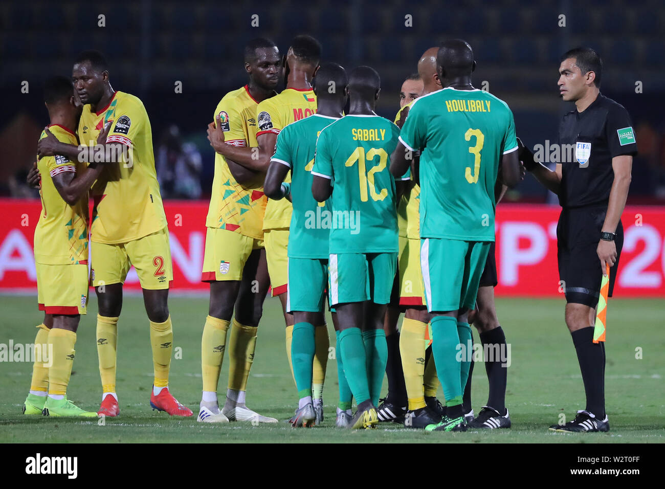 Cairo, Egypt. 10th July, 2019. Benin and Senegal players greet each ...
