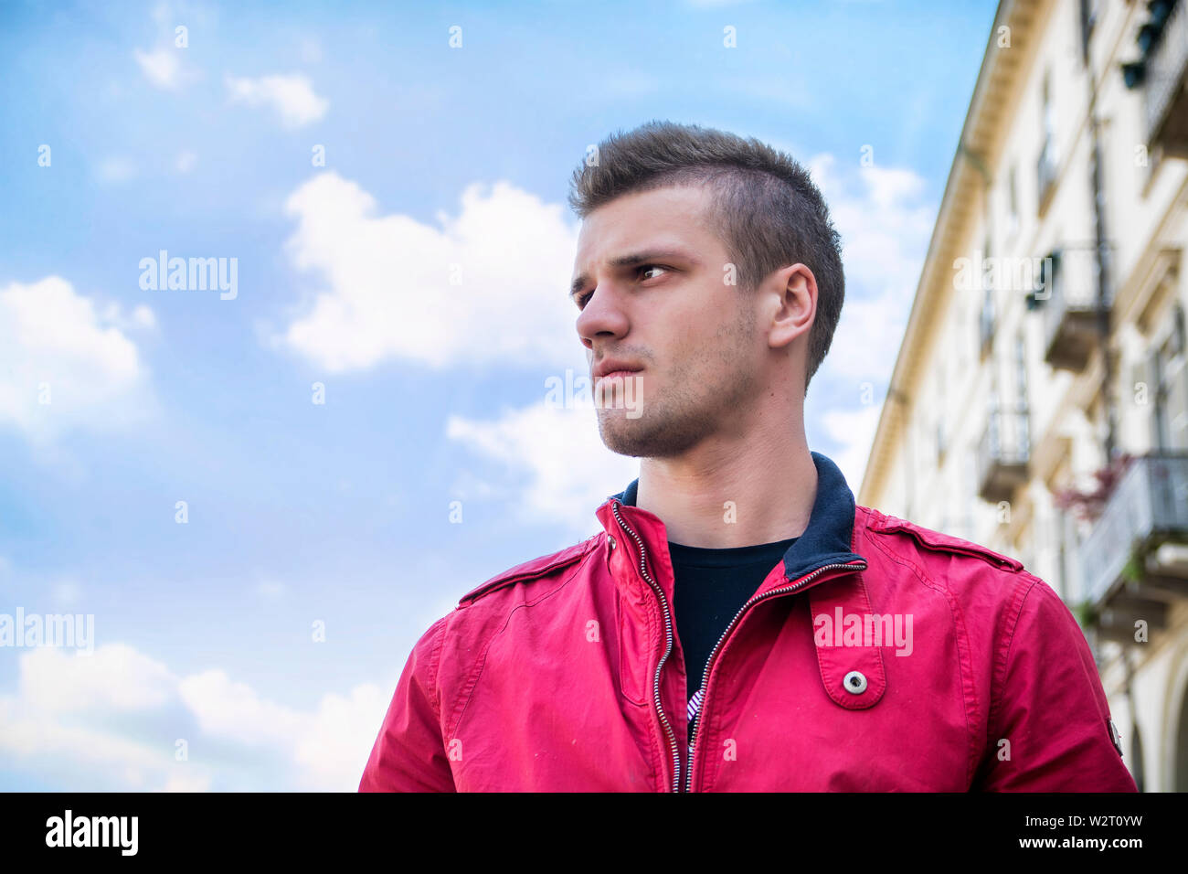 One handsome young man in city setting Stock Photo - Alamy