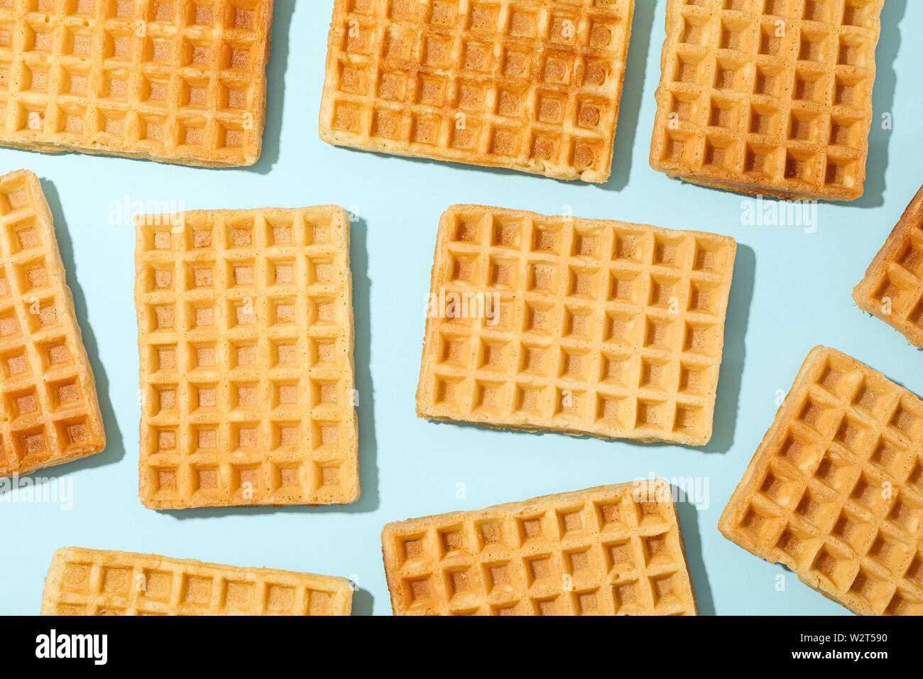 Flat lay composition with belgian waffles on color background Stock ...