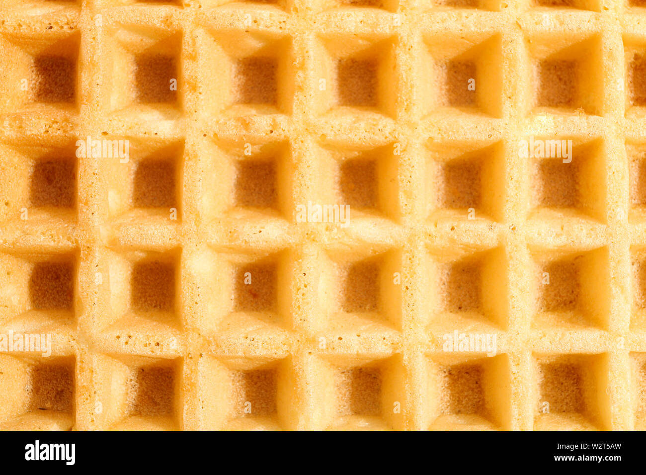 Belgian waffles texture as background, closeup Stock Photo - Alamy