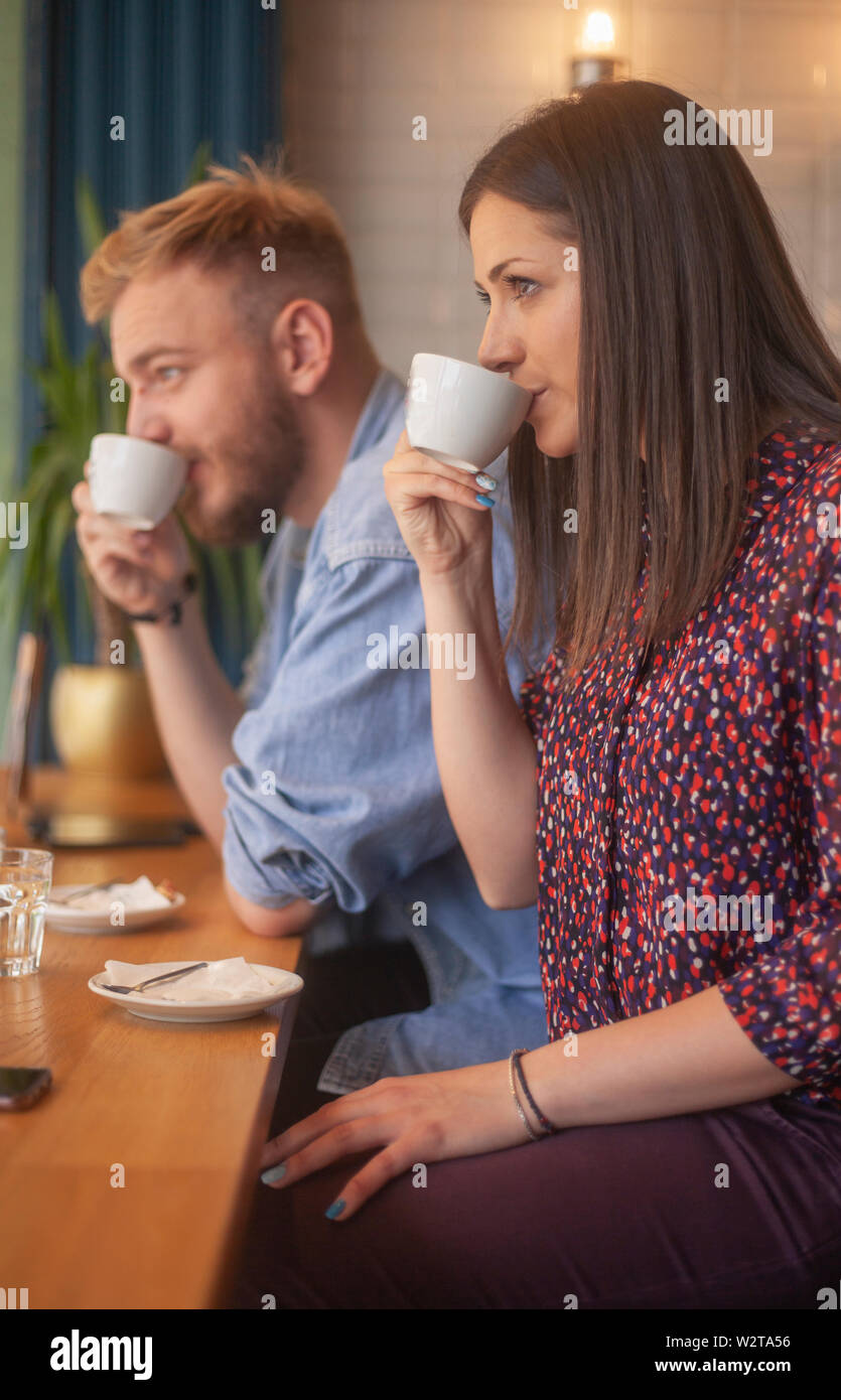 two friends, drinking coffee together Stock Photo - Alamy