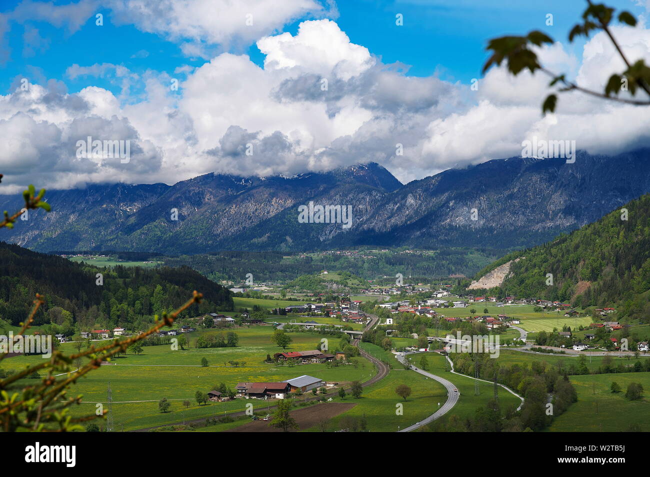 Village in a valley with mountains in the background hi-res stock ...