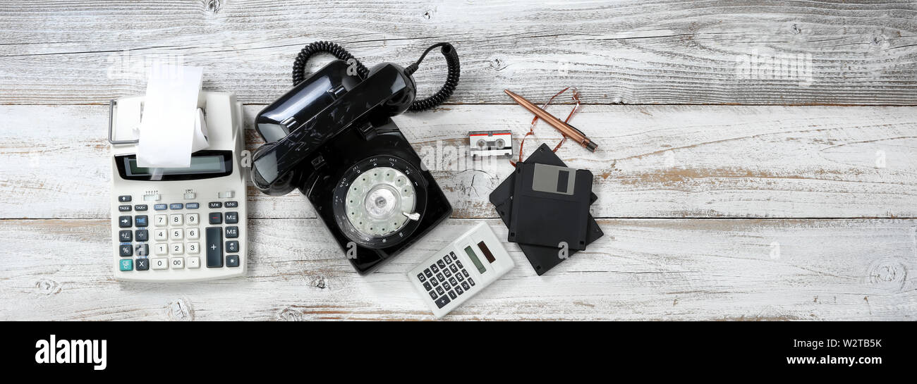 Overhead view of Vintage technologies that includes rotary dial phone ...