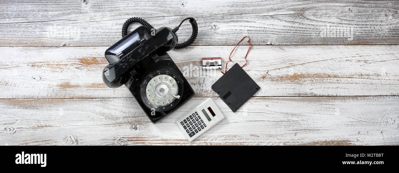 Vintage technology includes rotary dial phone and old data storage ...