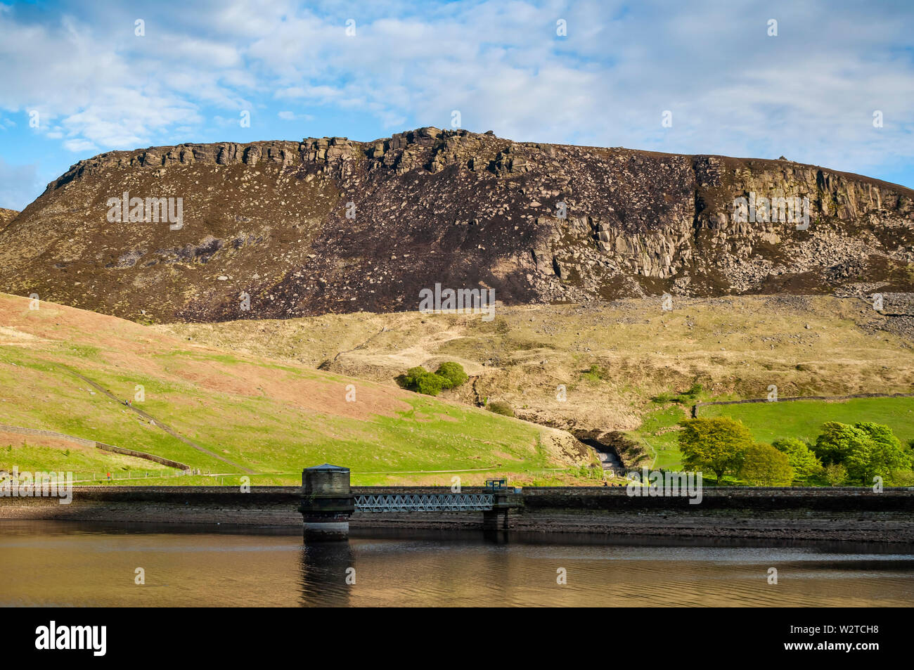 Gritstone outcrop high above the dam wall of Dove Stone Reservoir near ...