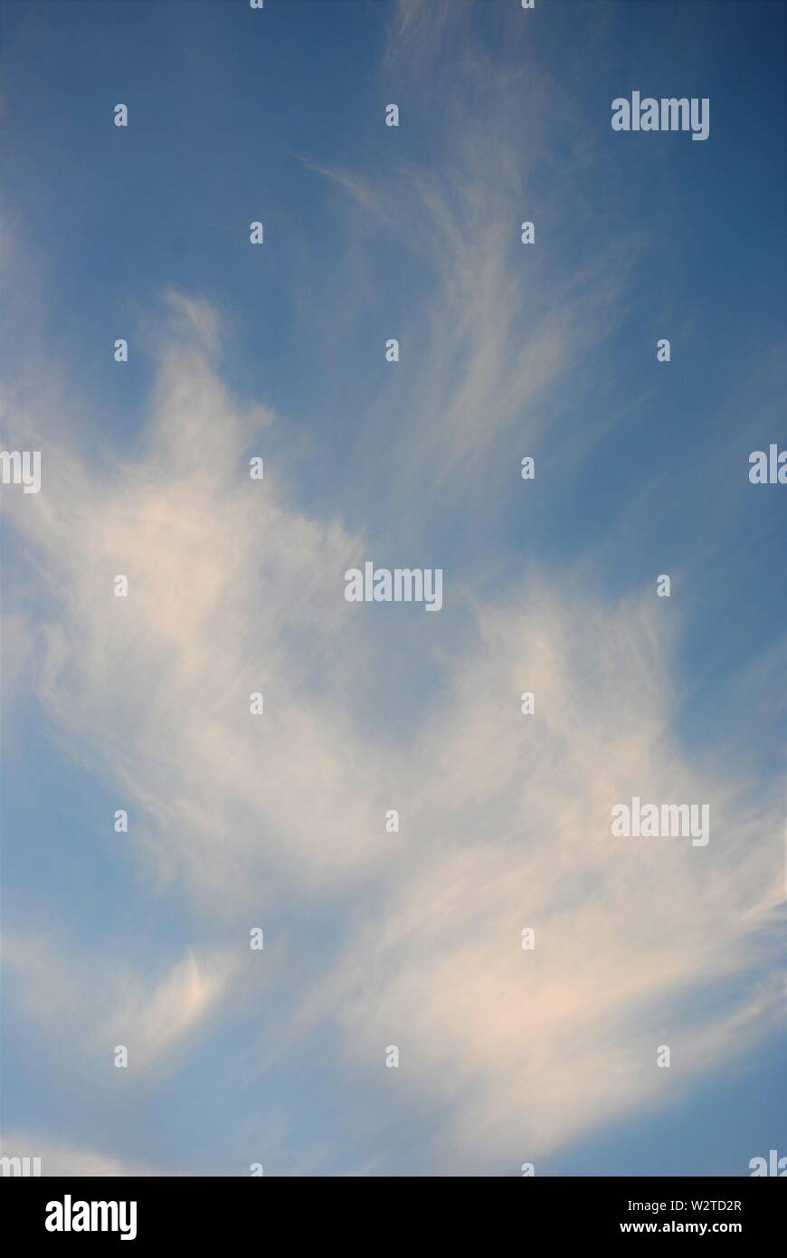 Abstract pattern of white wispy clouds in a blue sky Stock Photo - Alamy