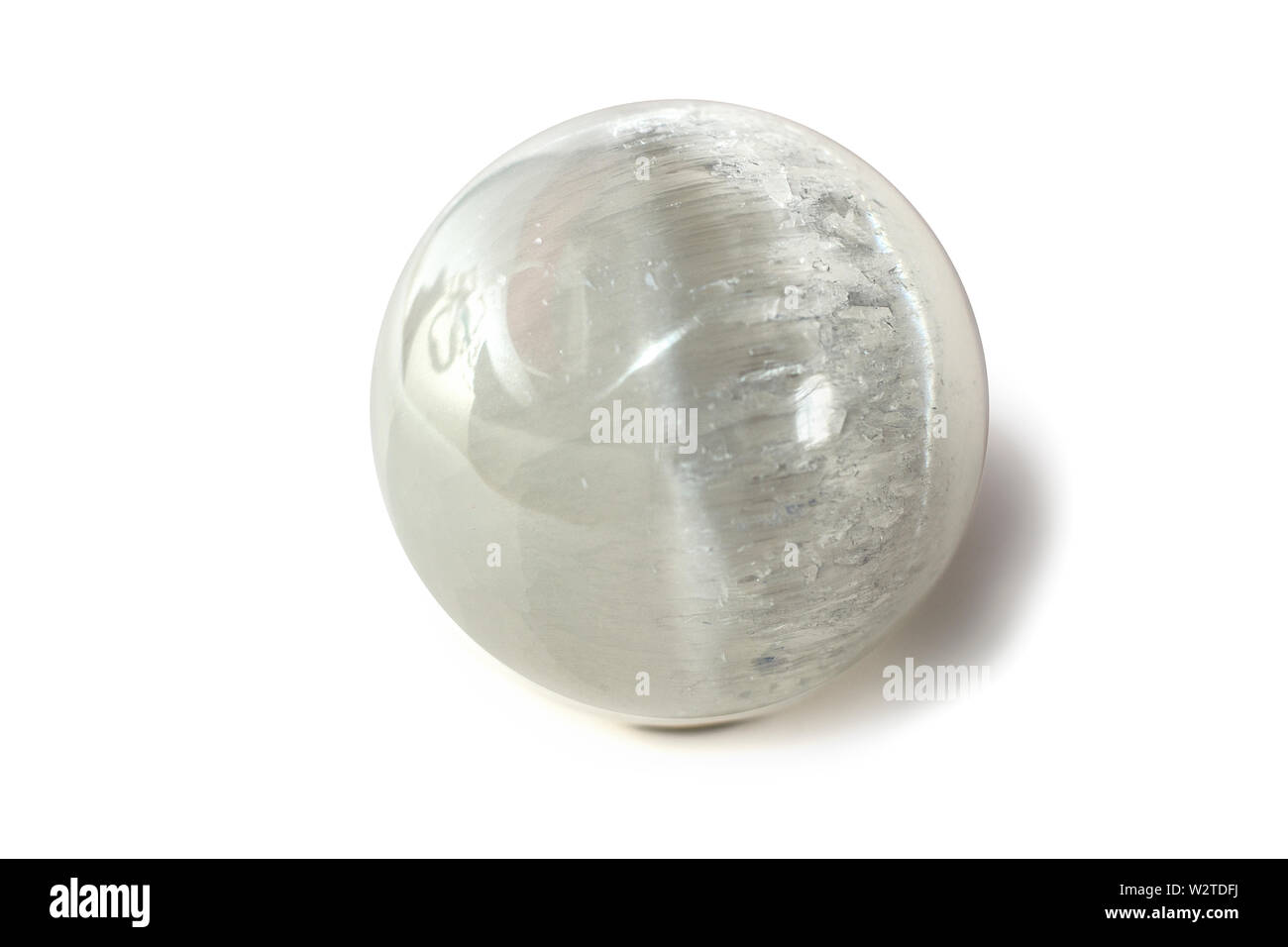 Beautiful selenite sphere mineral on white background Stock Photo - Alamy